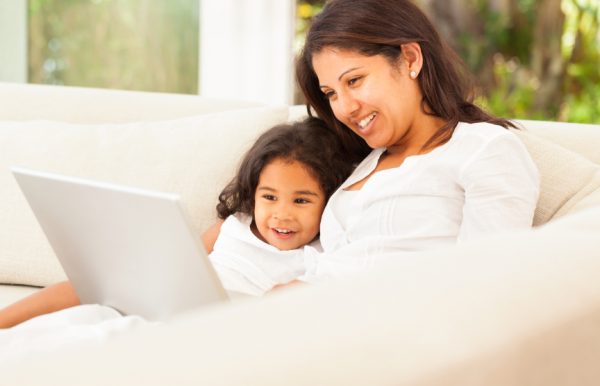 Mother With Daughter Working On Laptop – Trapp Technology